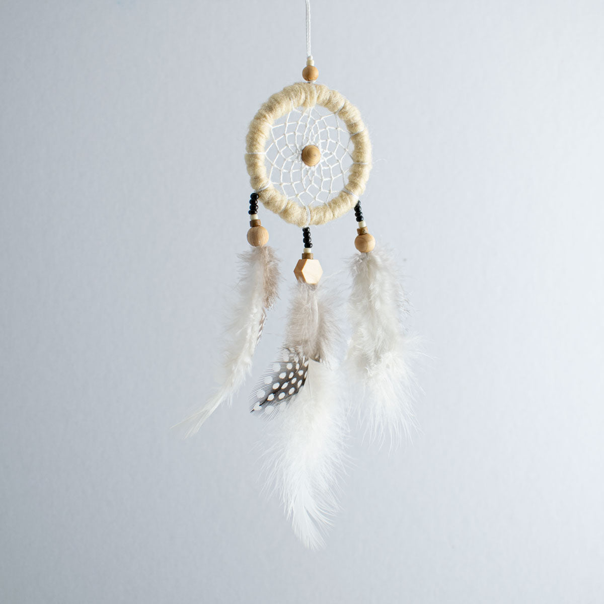 Mini attrape-rêve beige "Aigle éclairé" – Le Nuage et la Dune